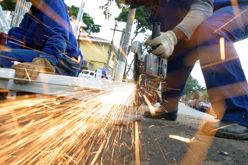 Man at work grinding steel stock image. Image of craft - 18204559