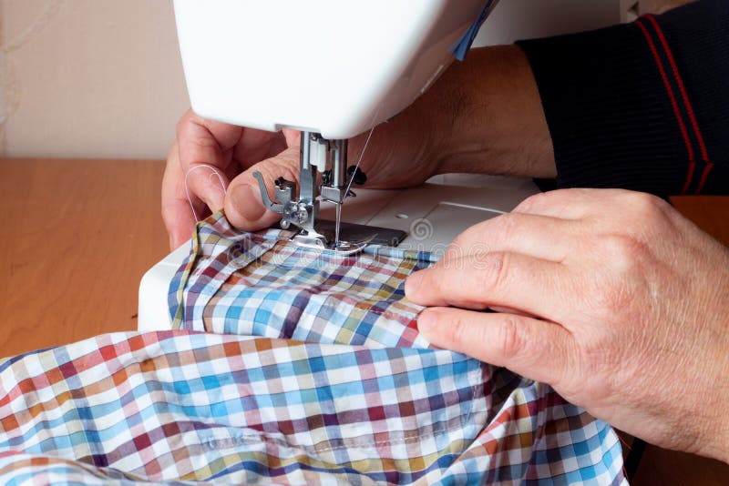 Man at Work Near a Sewing Machine, Sewing Clothes Stock Photo - Image ...