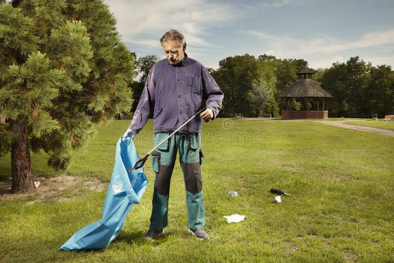 Man at Work Pick Up Garbage on Grass in Park Stock Image - Image of ...