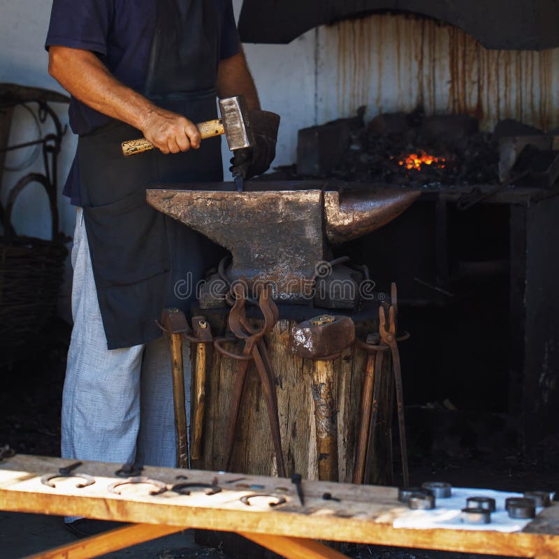 Man working in smithy stock image. Image of profession - 121882323