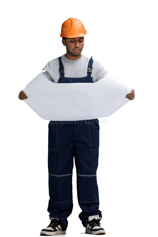 A Man in a Work Uniform on a White Background with a Blueprint Looks To ...