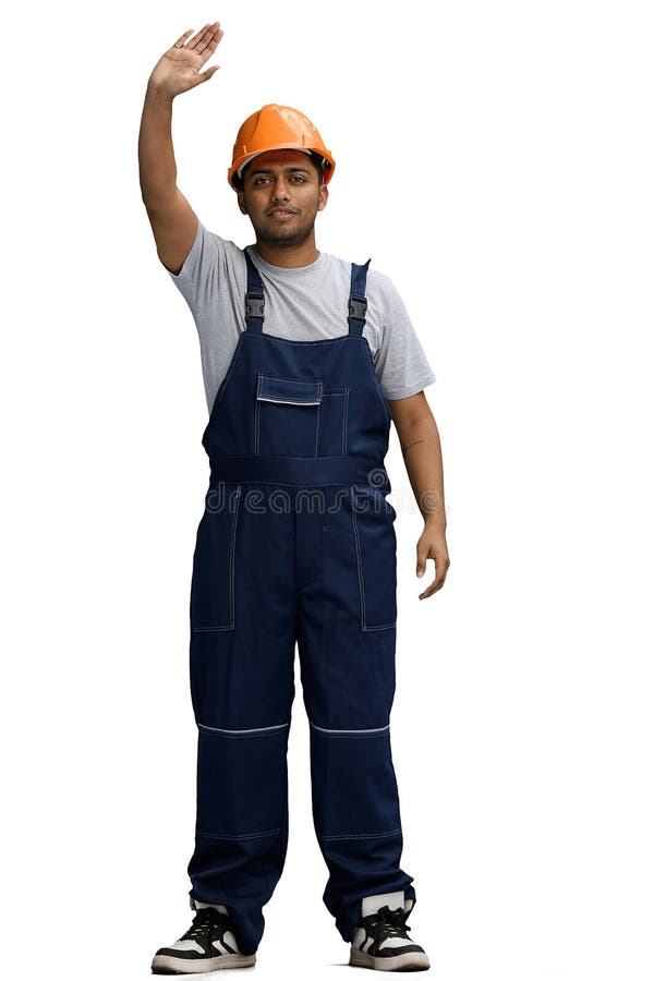 A Man in a Work Uniform on a White Background Waves His Hand Stock ...