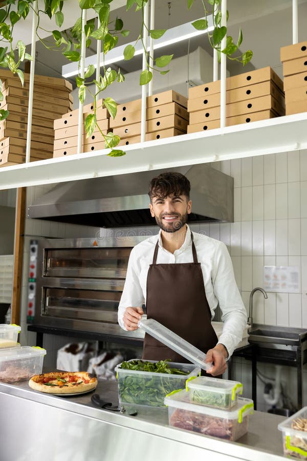 Man Worker at Cafe Kitchen Making Professional Pizza Stock Image ...