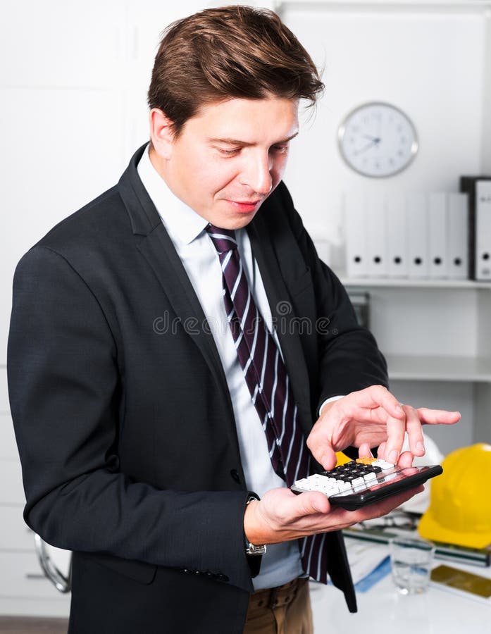 Man Worker Calculating in the Office Stock Image - Image of work, shape ...