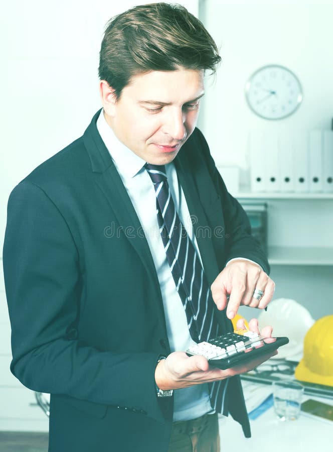 Man Worker Calculating in the Office Stock Photo - Image of account ...