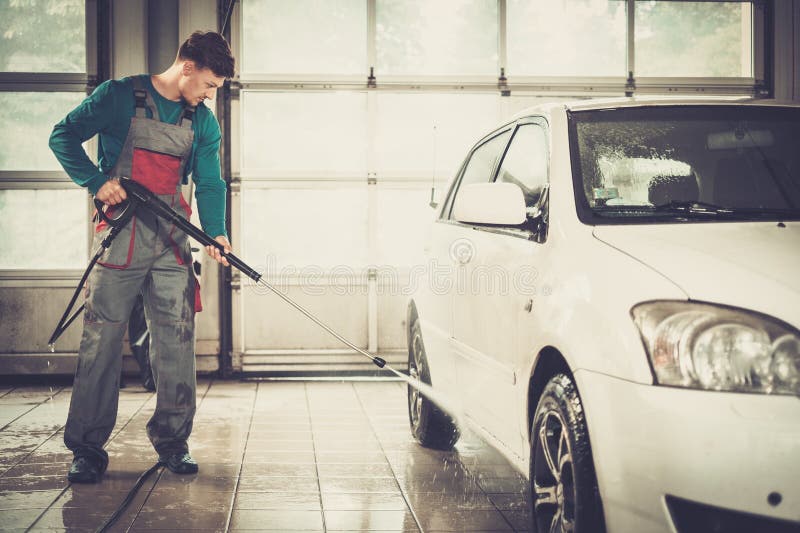 Man worker on a car wash stock image. Image of station - 57163825