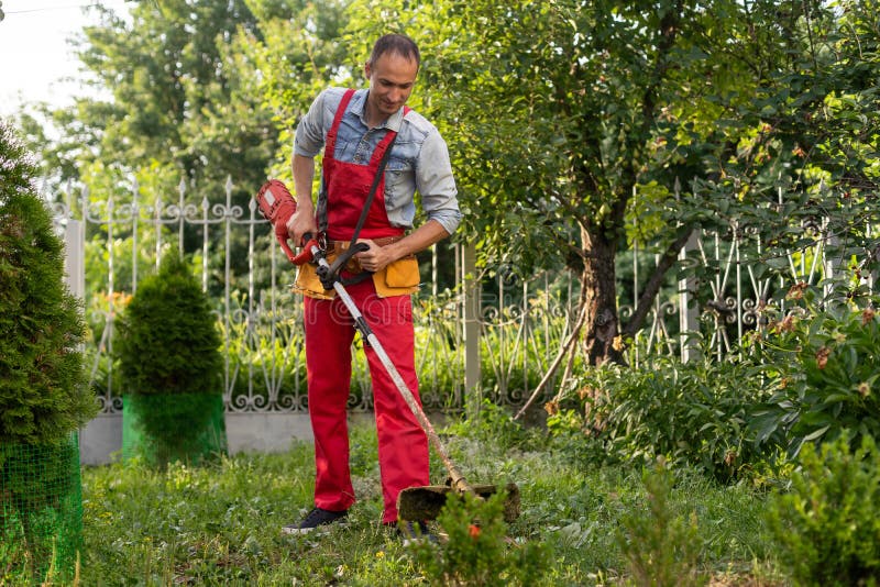 Man Worker Cutting Grass with Lawn Mower. Stock Image - Image of ...