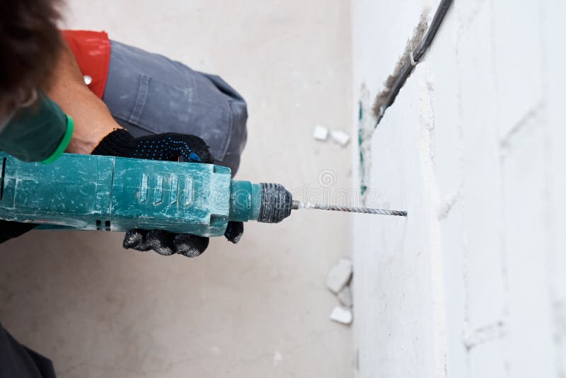 Man Worker Drilling Wall with Hammer Drill, Top View Stock Image ...