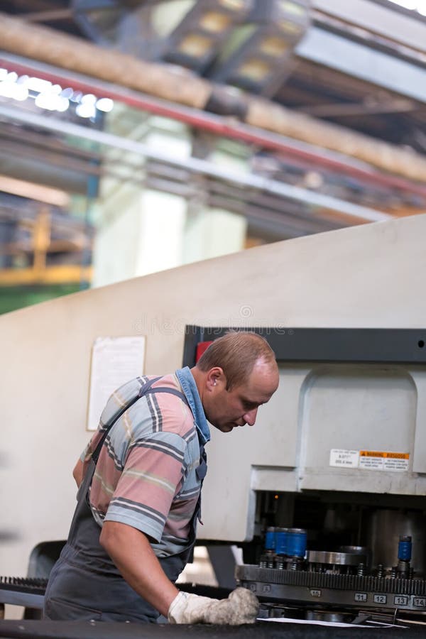 Man Worker at Factory Workshop Adjusting Equipment Stock Image - Image ...