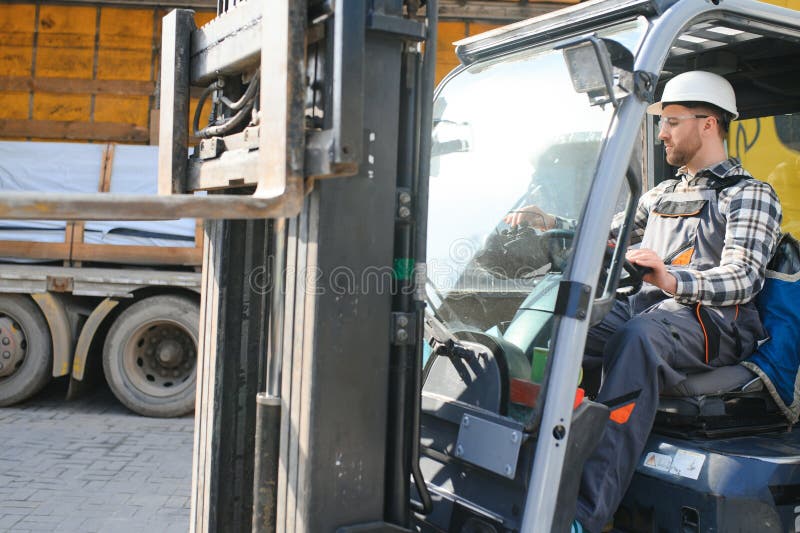 Man Worker at Forklift Driver Happy Working in Industry Factory ...