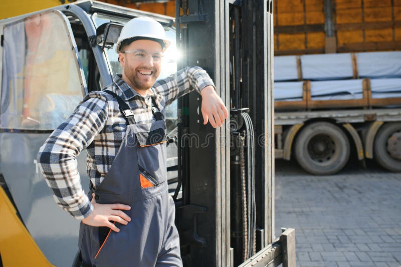Man Worker at Forklift Driver Happy Working in Industry Factory ...
