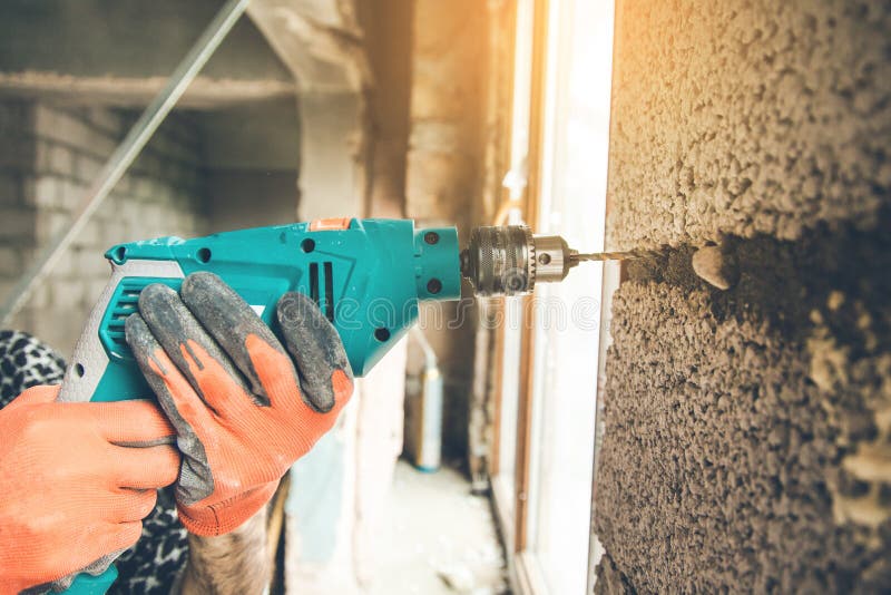 Man Worker Hand Drill with Wall Stock Photo - Image of device, power ...