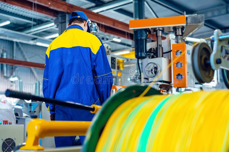 Man Worker in Manufacturing Plant at Cable Factory Machine Control ...