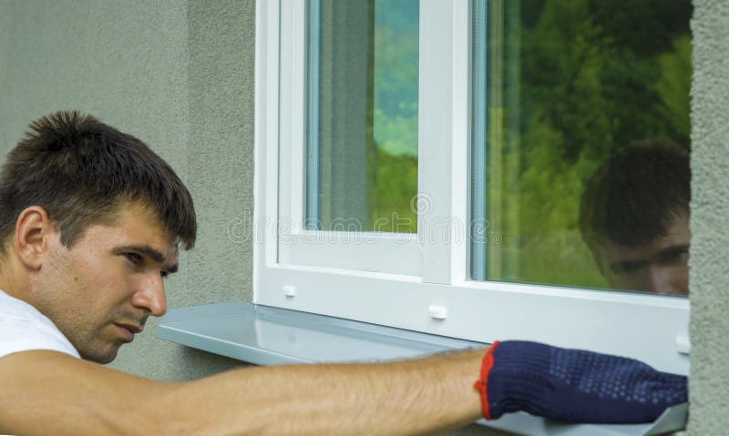 Man Worker in Protective Gloves Measuring External Frame and PVC Window ...