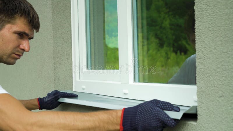 Man Worker in Protective Gloves Measuring External Frame and PVC Window ...