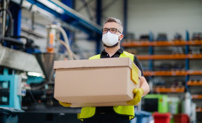Man Worker with Protective Mask Working in Industrial Factory or ...