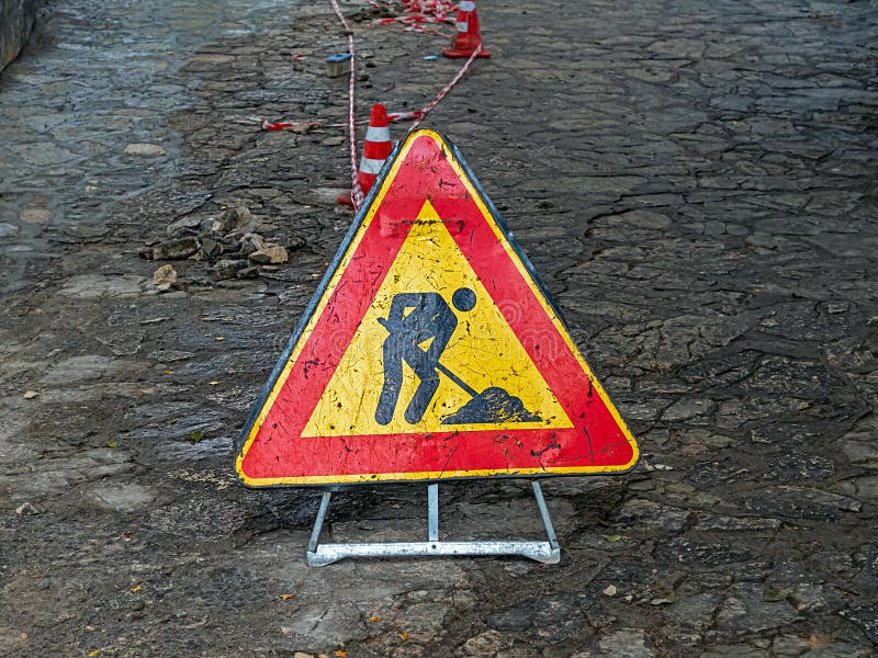 Man Worker Triangle Sign on Street Stock Image - Image of warning ...
