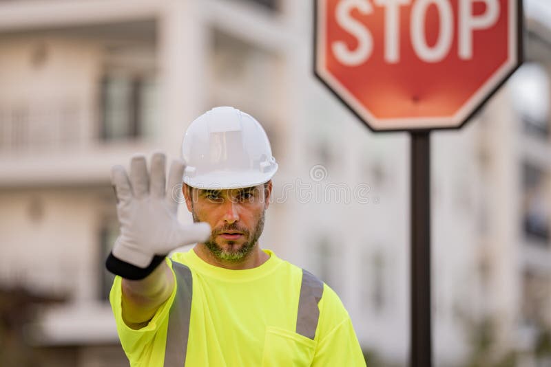 Man in Worker Uniform and Hardhat with Open Hand Doing Stop Sign with ...