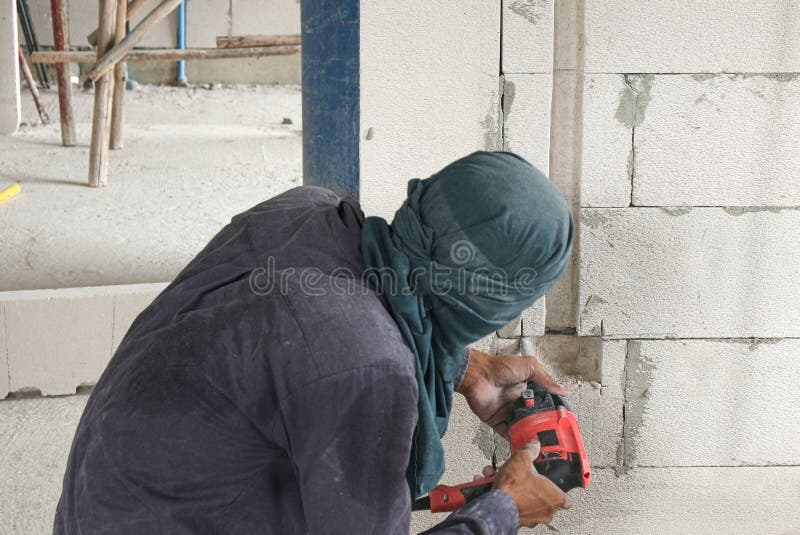 Man Worker Use Red Electric Drill Make Block on White Pillar Structure ...