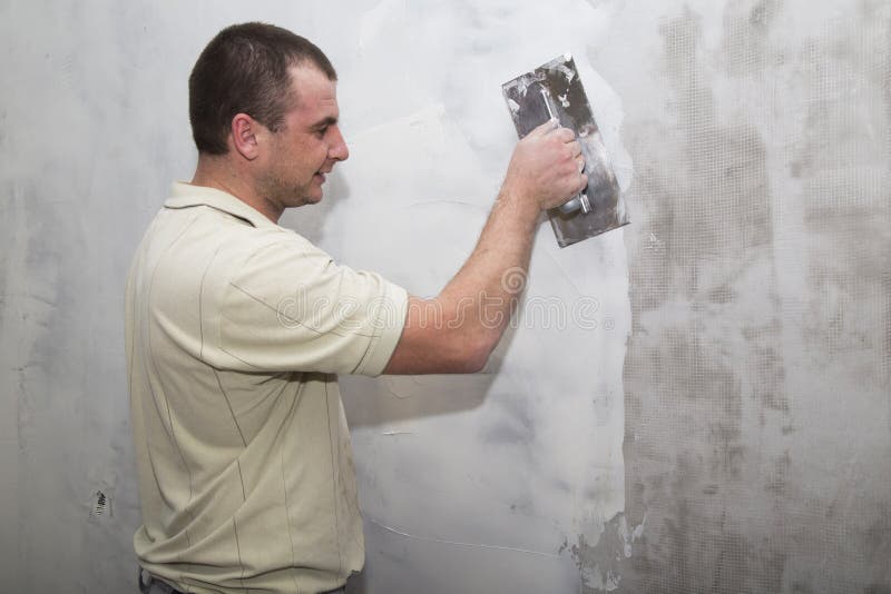 Man Worker Using Float To Apply First Layer of Putty Stock Photo ...