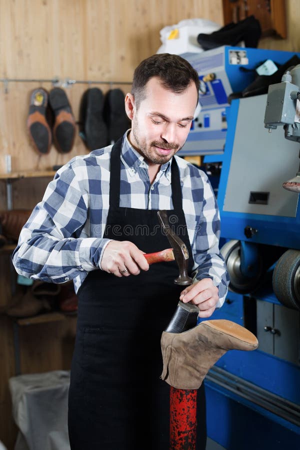 Man Worker Using Instruments for Fixing in Shoe Repair Stock Image ...