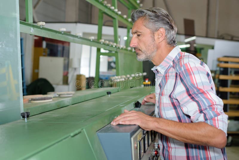 Man Worker Using Machine at Lumbermill Factory Stock Photo - Image of ...