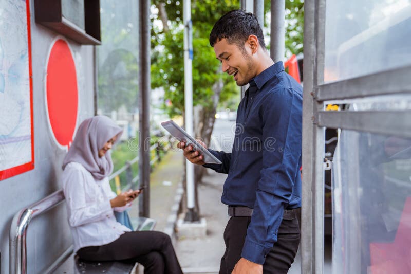 Man Worker Using Tablet Digital Stand Waiting for the Bus Stock Image ...