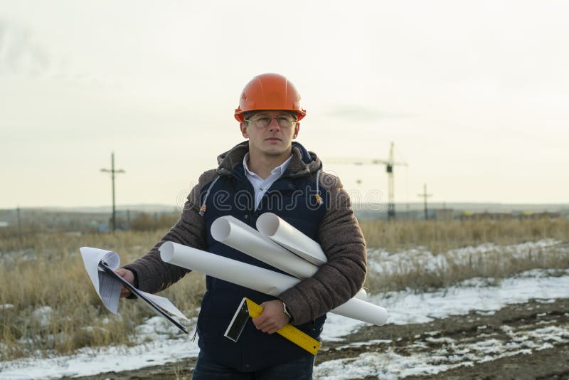 The Man Worker Wear a Orange Helmet with Construction Site Stock Photo ...