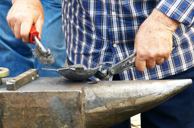 Man working on the anvil stock photo. Image of hammer - 132900014