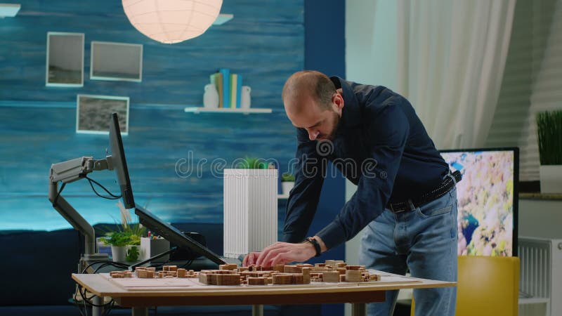 Architect Analyzing Blueprints and 3d Building Models Stock Video ...