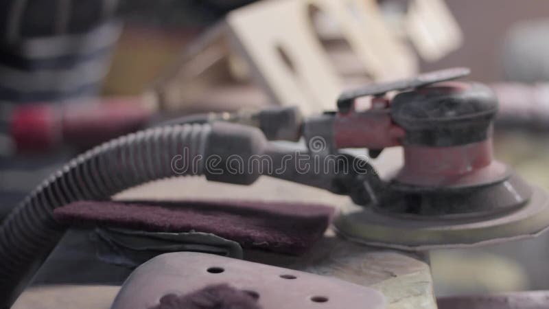 Sanding Machine with Working Man at the Background Stock Footage ...
