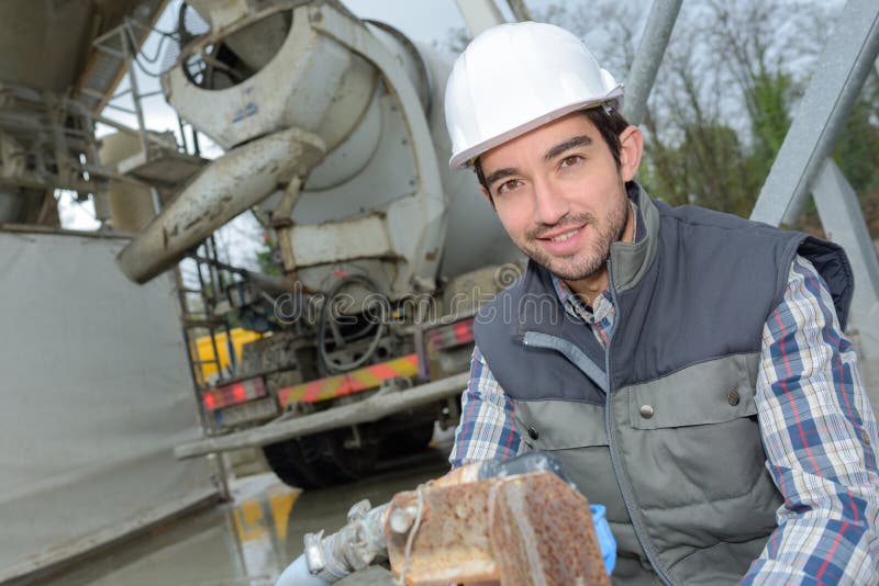 Man Working Behind Cement Truck Stock Image - Image of foliage, truck ...