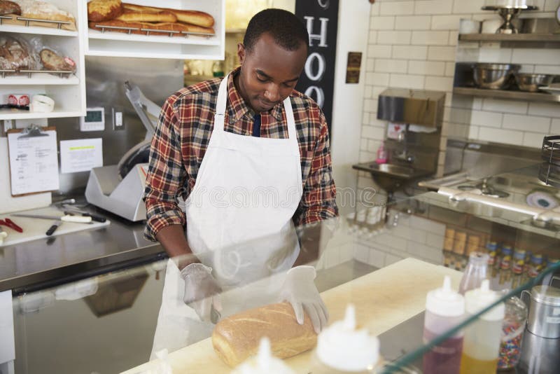 Man Working Behind the Counter at a Sandwich Bar Stock Photo - Image of ...