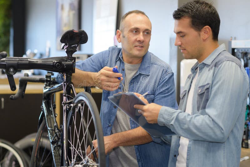 Man Working in Bike Workshop Stock Photo - Image of craftsmanship, gear: 267512932