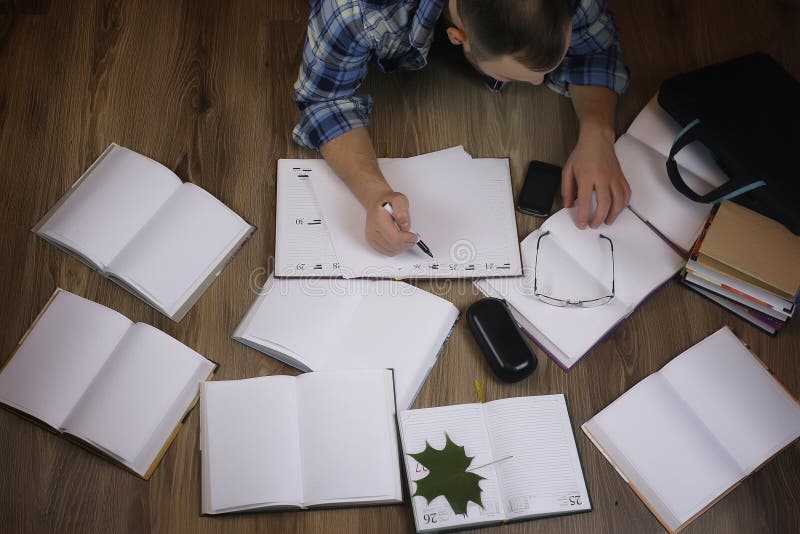 Man Working with Book on the Floor Stock Photo - Image of handsome ...