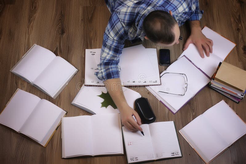 Man Working with Book on the Floor Stock Photo - Image of casual ...