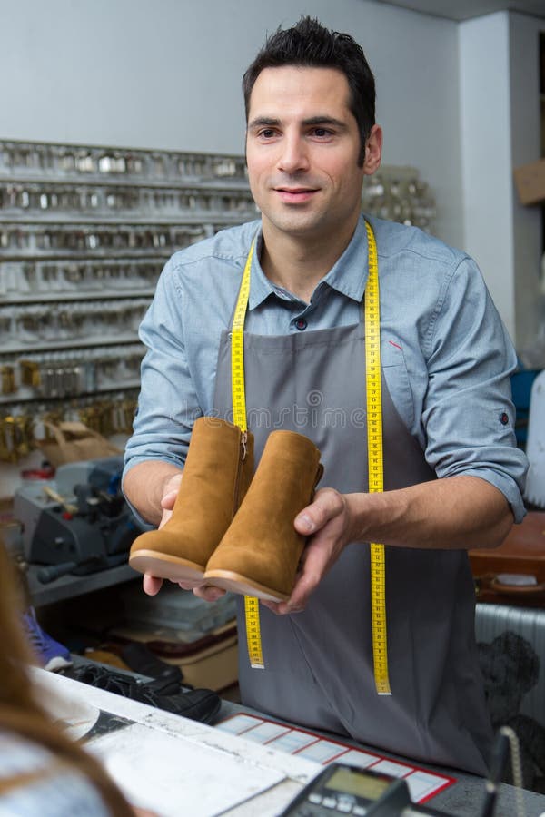 Man working with boots stock image. Image of dress, professional ...