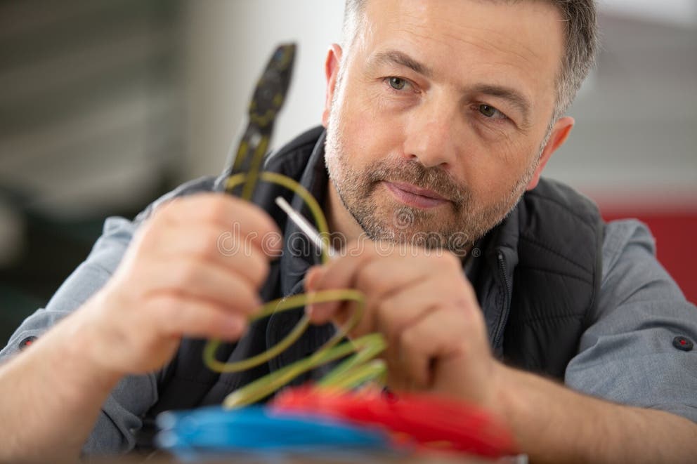 Man Working with Cables in Workshop Stock Photo - Image of energy, supply: 332669890