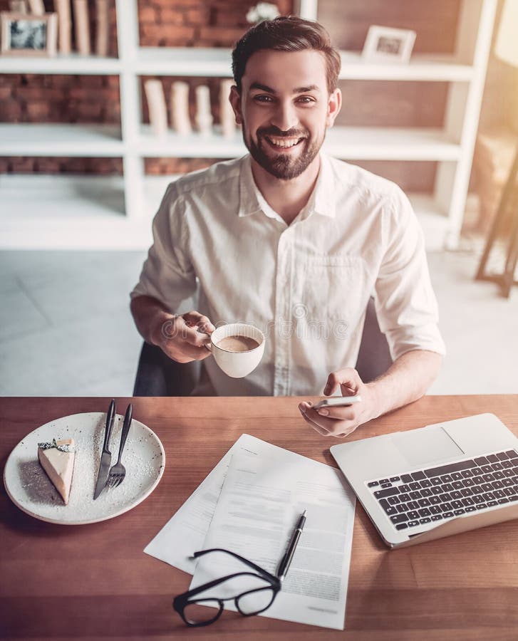 Man working in cafe stock photo. Image of person, communication - 94187716