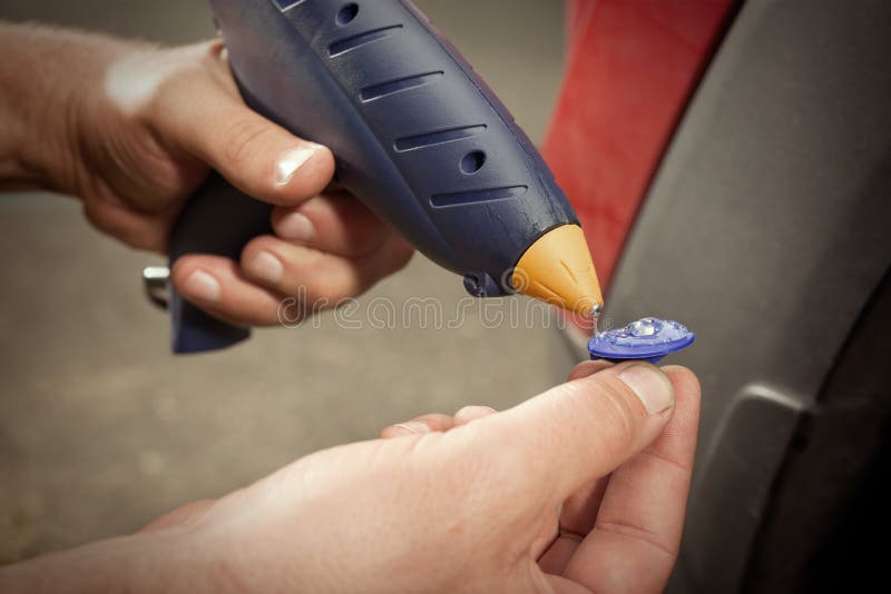 Man Working on a Car Dent Self Repair with Reverse Hammer Set of Tools ...