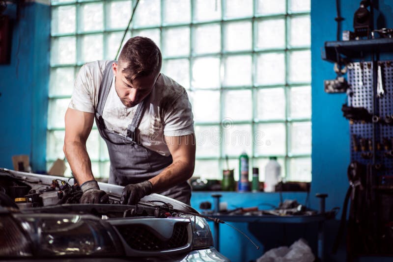 Man Working in Car Workshop Stock Photo - Image of technician ...