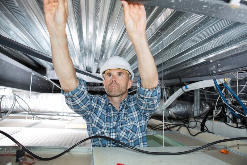 Man working with ceiling stock photo. Image of danger - 161225566