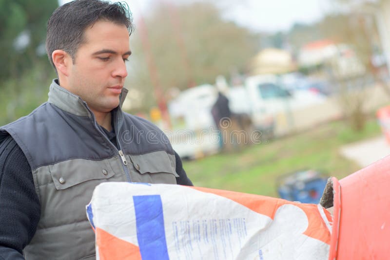 Man working cement mixer stock image. Image of cement - 302705357
