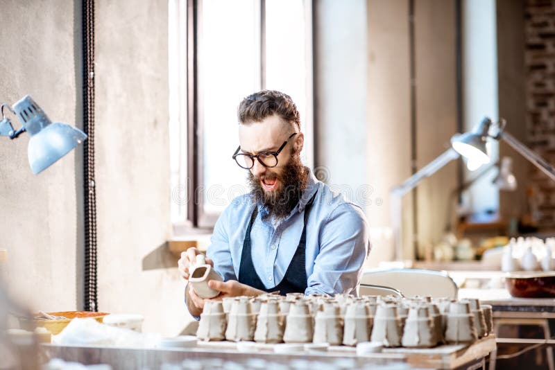 Man Working with Ceramics at the Pottery Stock Photo - Image of window ...