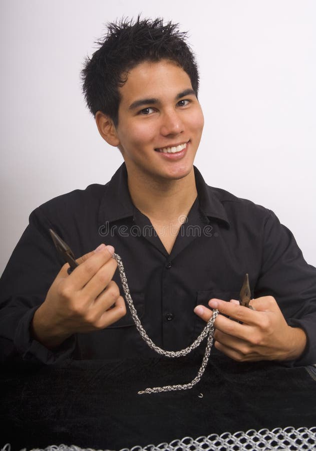 Man Working on a Chain Mail Necklace Stock Image - Image of face ...