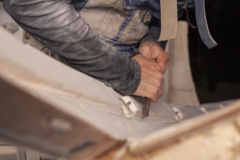 Man working with a chisel stock photo. Image of workshop - 55337786