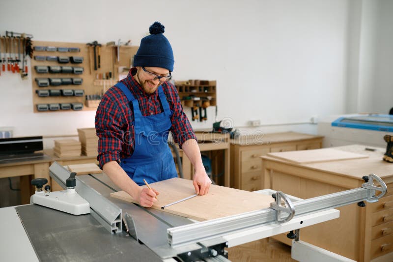 Man Working on Circular Saw and Engaged in Making Wooden Blank at ...