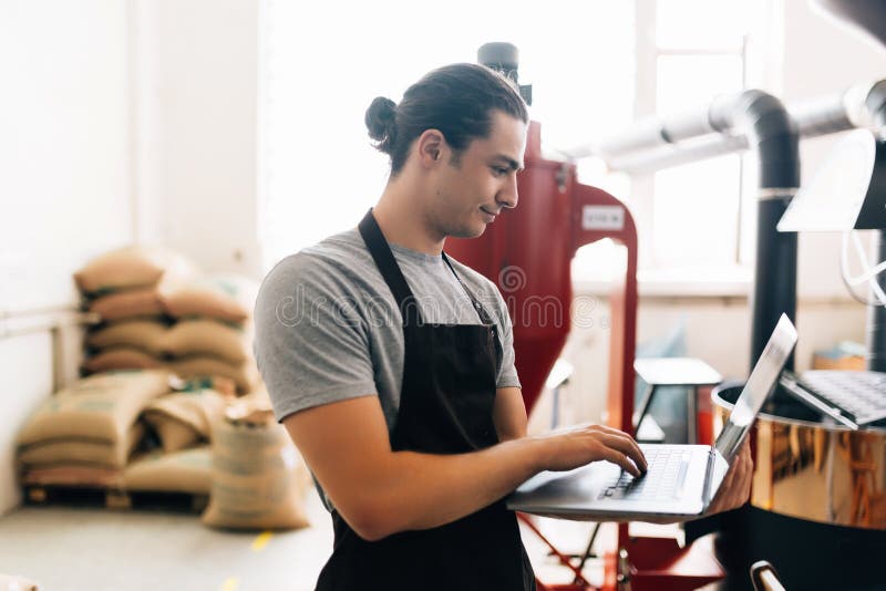 Man Working at Coffee Production. Barista Adjusting Coffee Machine and ...