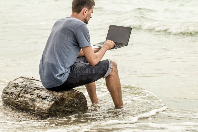 Man Working with Computer on the Beach Stock Photo - Image of student ...