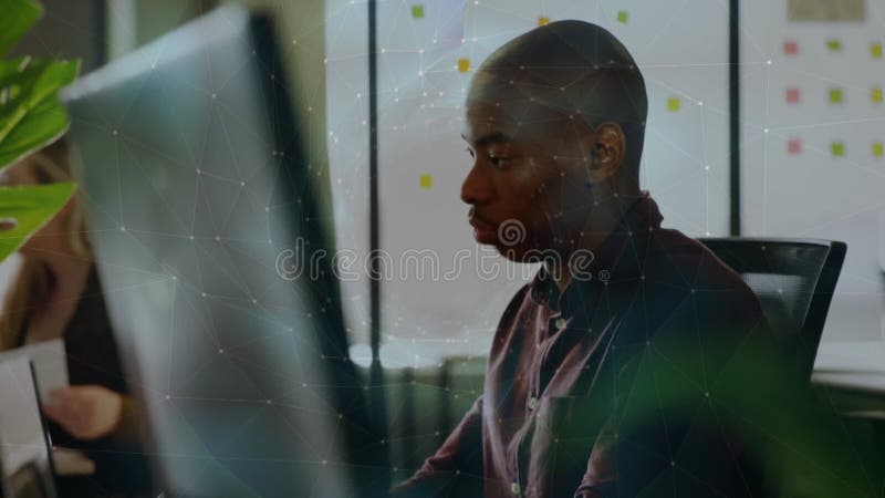 Man Working on Computer in Business Office, Showing Animated Charts ...